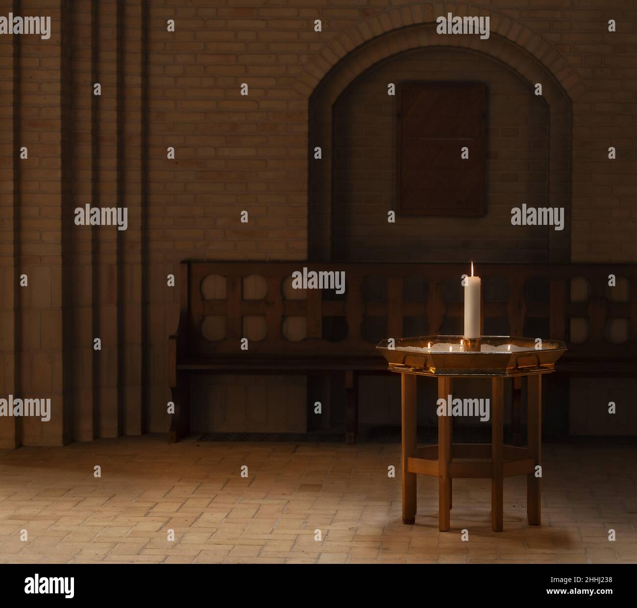 Burning candle in the church Stock Photo - Alamy