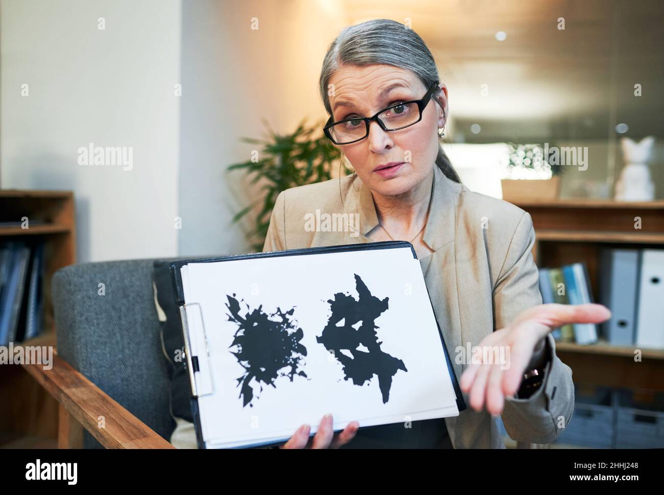 What you see says a lot. Portrait of a mature psychologist holding up ...