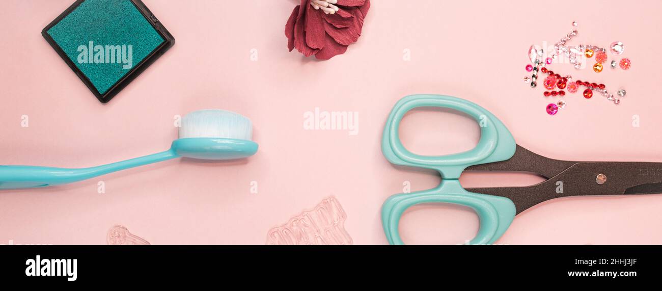 Papercraft accessories on light pink background Stock Photo - Alamy