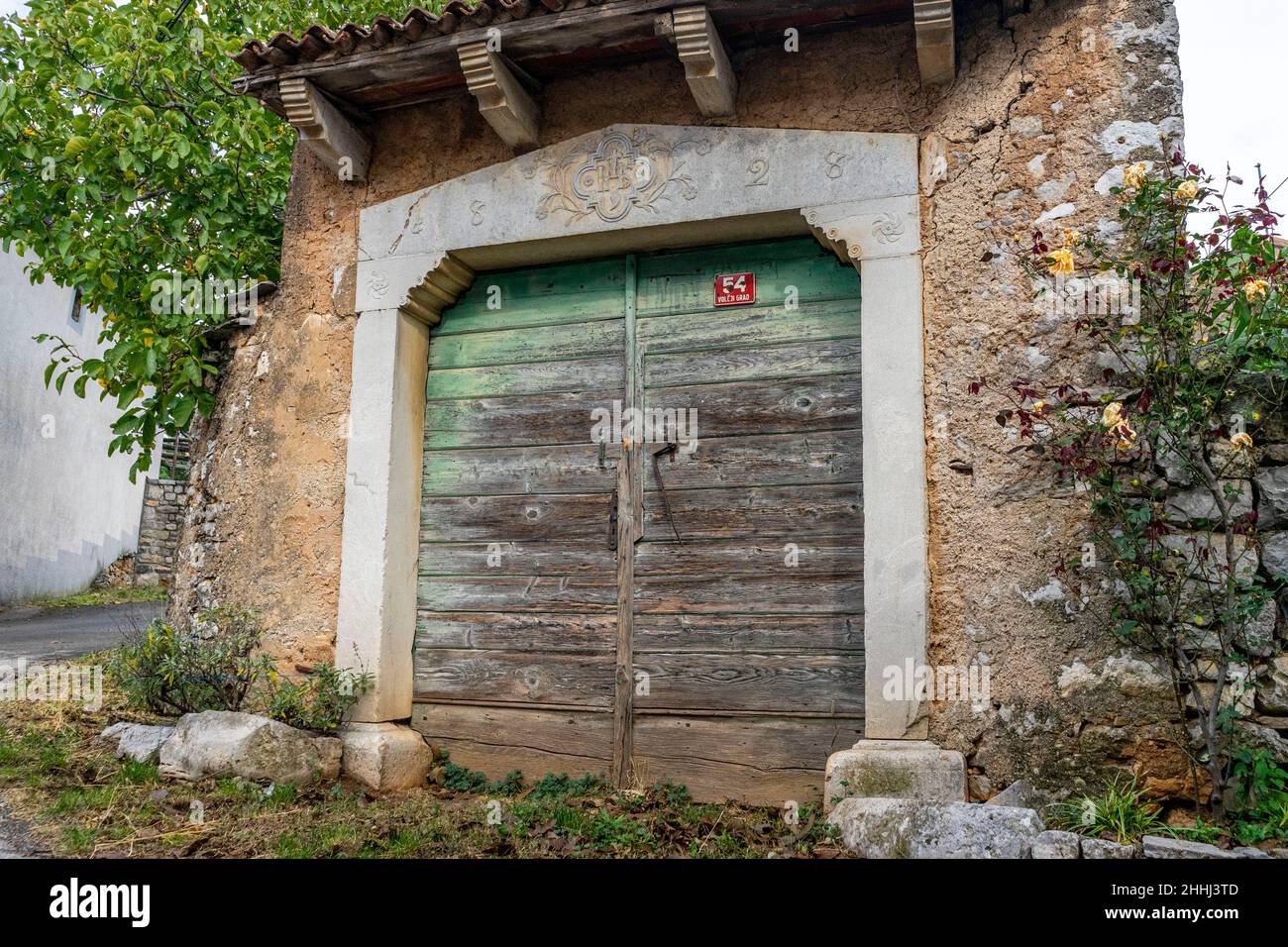 Traditional rustic entrance, big gates, in the Karst region in Slovenia ...