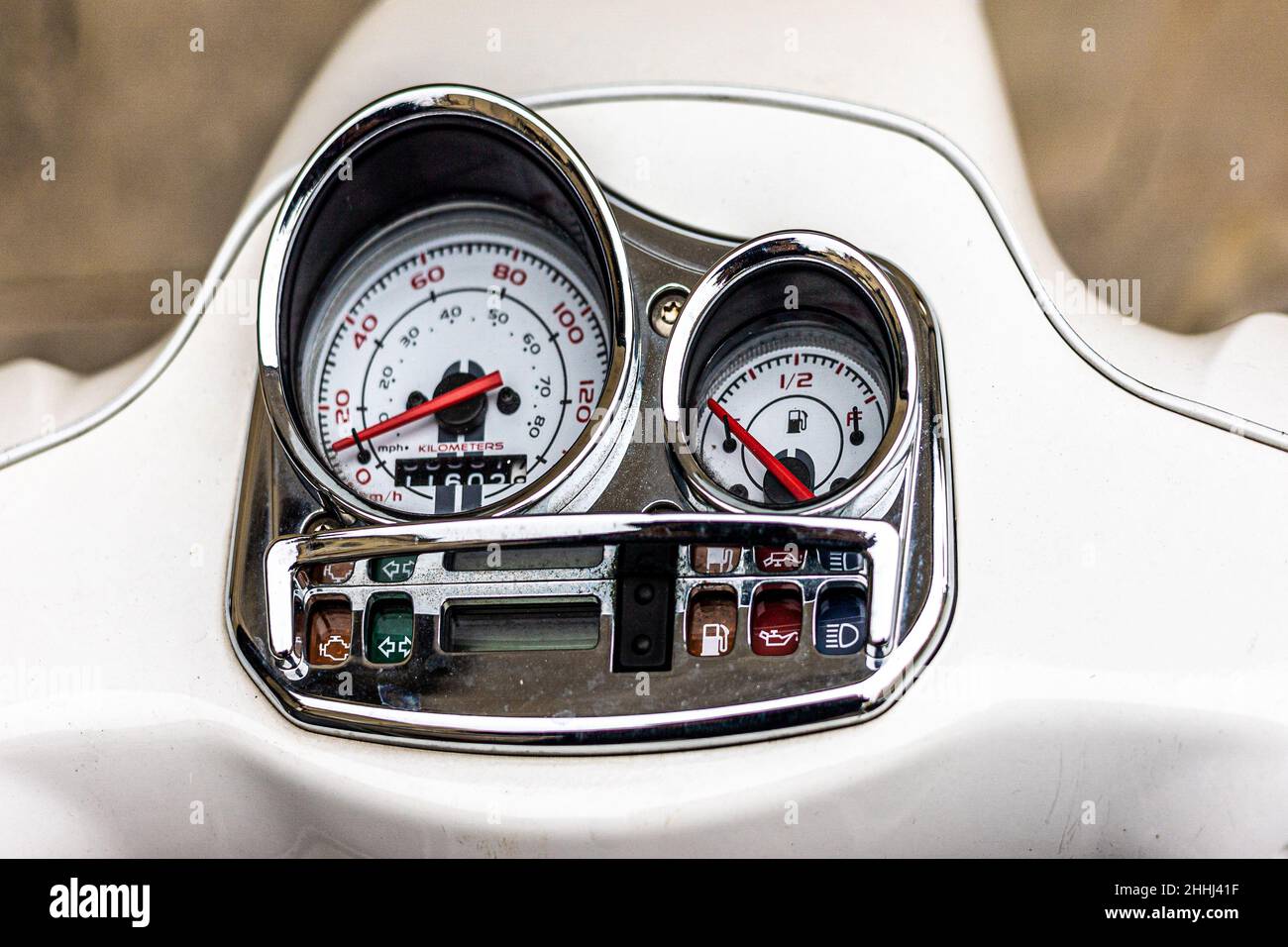 stylish odometer dials on a white moped Stock Photo - Alamy