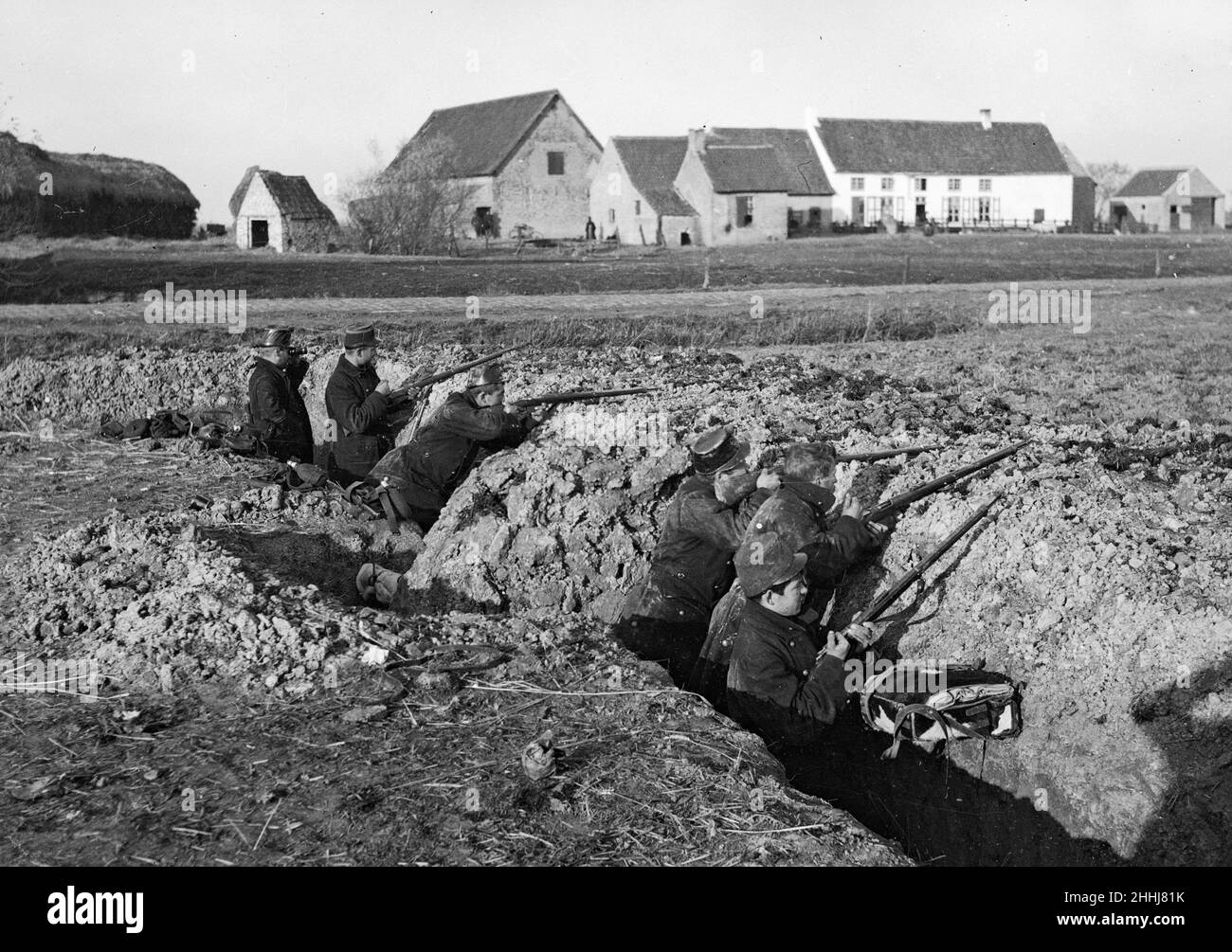 Belgian soldiers seen here in a hastily constructed trench close to ...