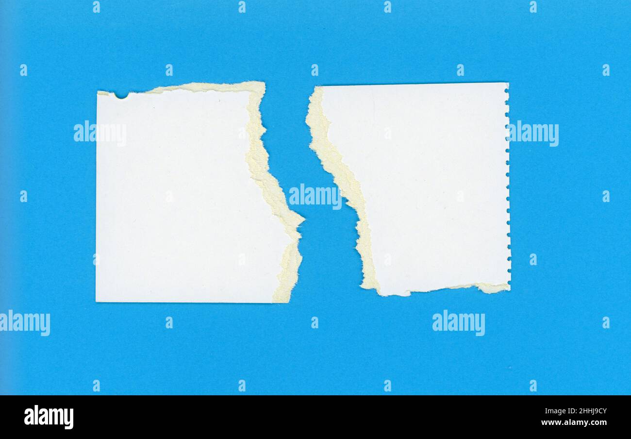 torn paper tag label over blue background Stock Photo - Alamy