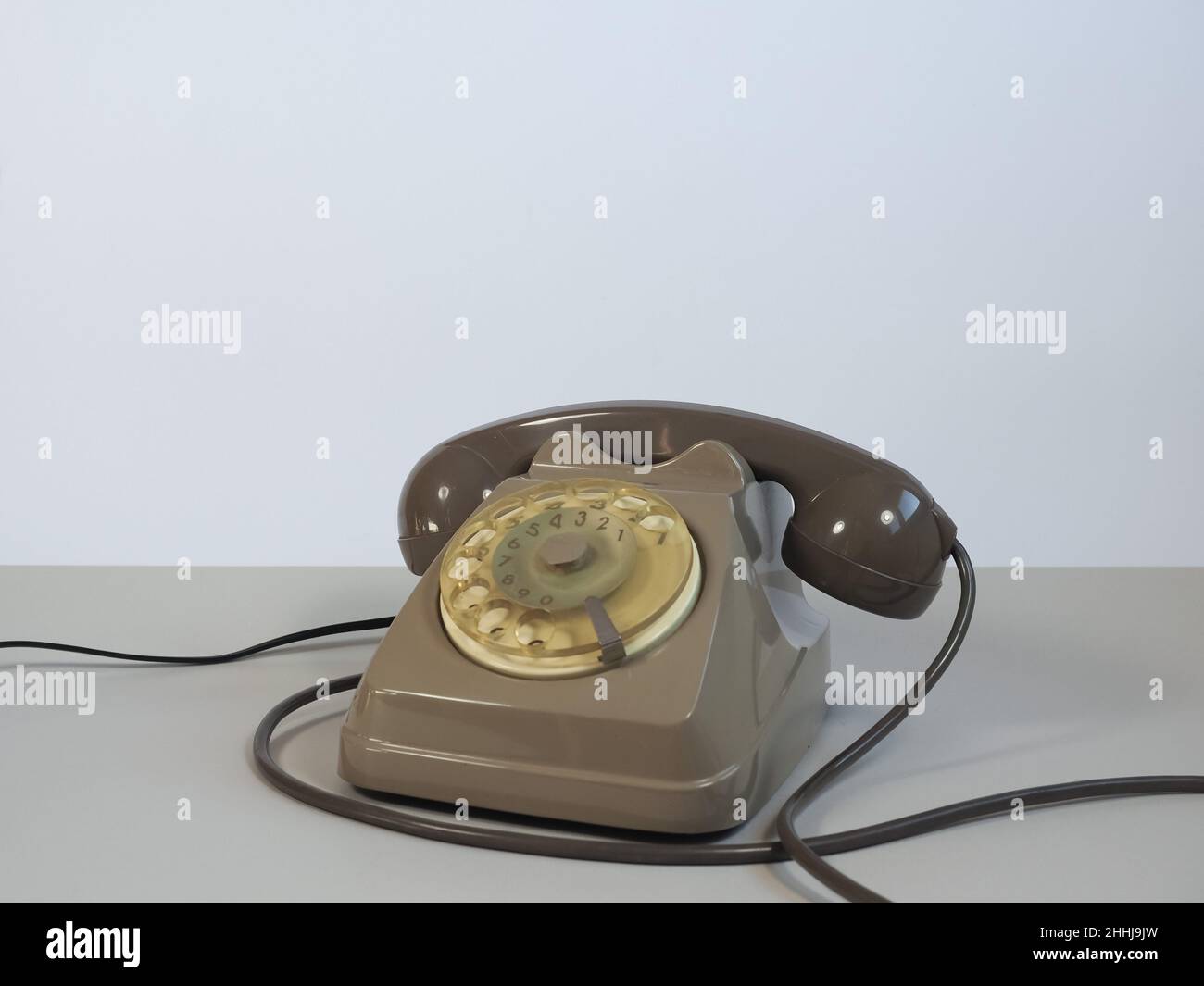 Vintage grey rotary dial analog landline telephone Stock Photo - Alamy