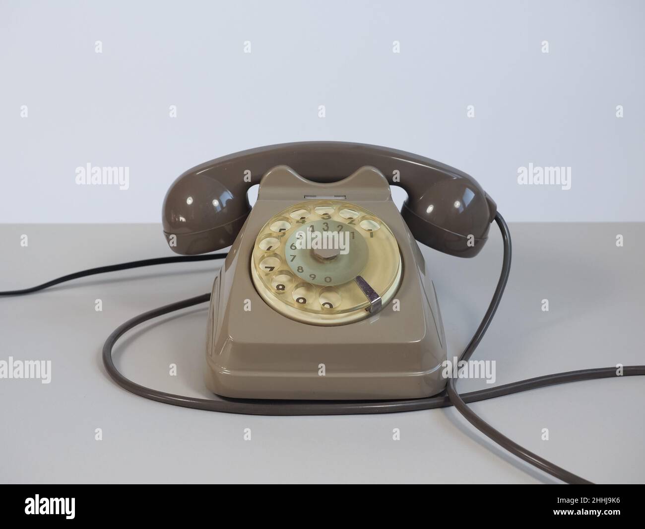 Vintage grey rotary dial analog landline telephone Stock Photo - Alamy