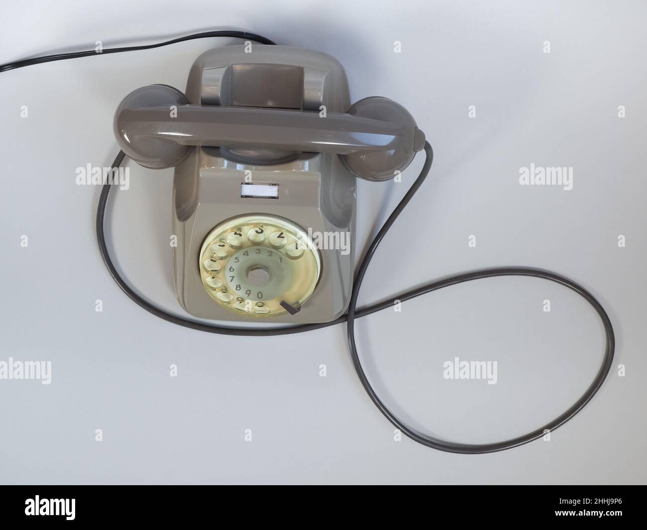 Vintage grey rotary dial analog landline telephone Stock Photo - Alamy