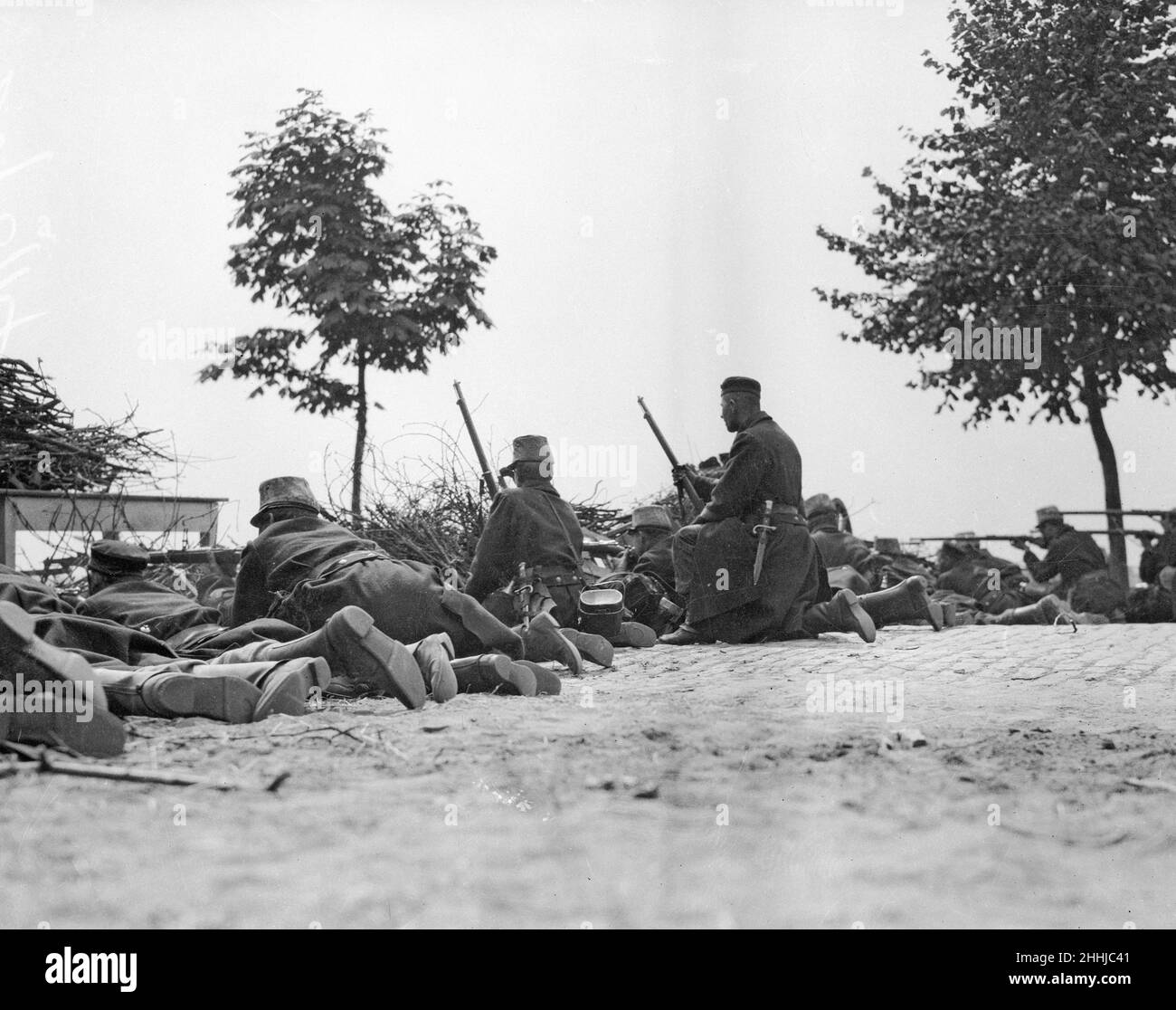 Belgian riflemen lying on the road facing the German advance at Louvain ...