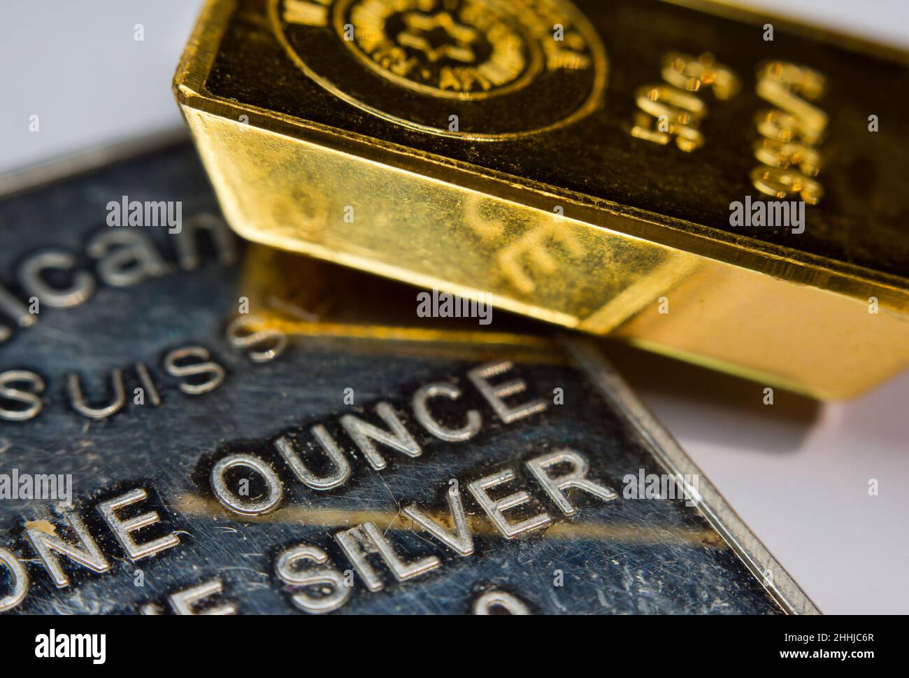 Close-up of a gold ingot on top of a troy ounce silver Stock Photo - Alamy