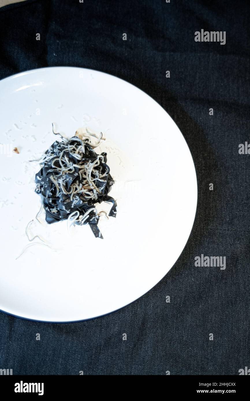 black pasta handmade dish fresh undercooked Stock Photo - Alamy