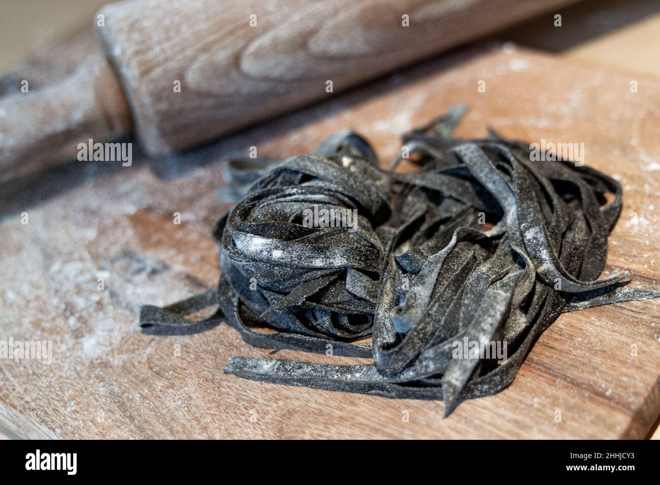 black pasta handmade dish fresh undercooked Stock Photo - Alamy