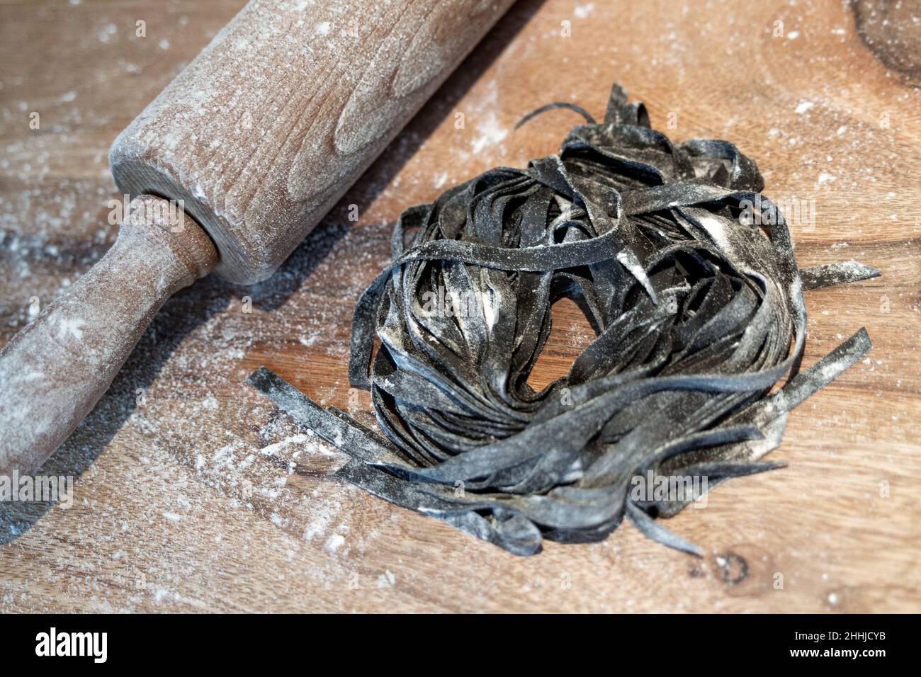 black pasta handmade dish fresh undercooked Stock Photo - Alamy