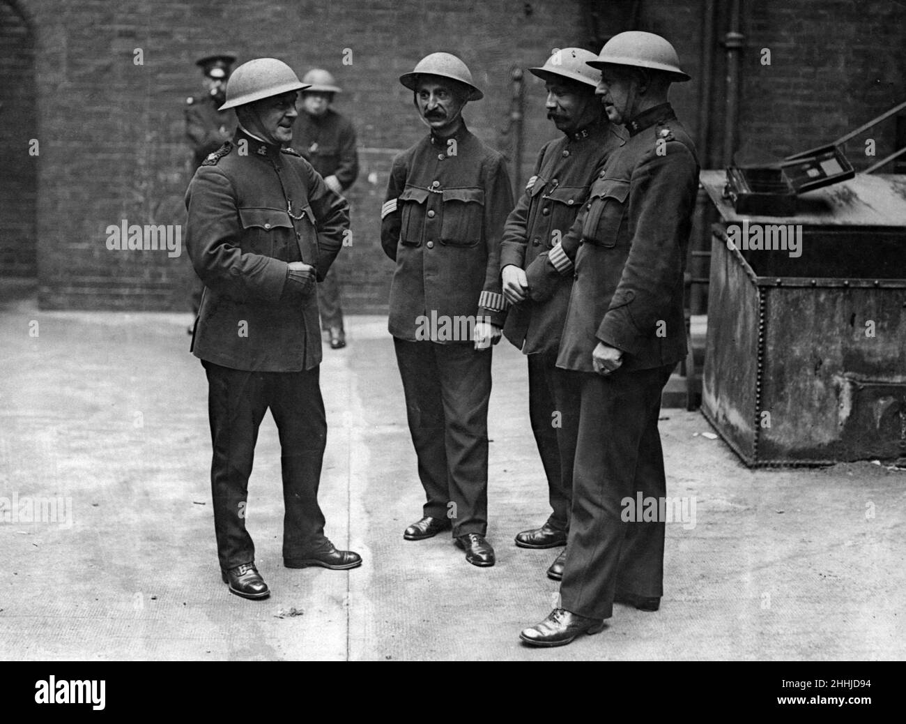 Steel helmets for the London special constables. "Do you find them ...