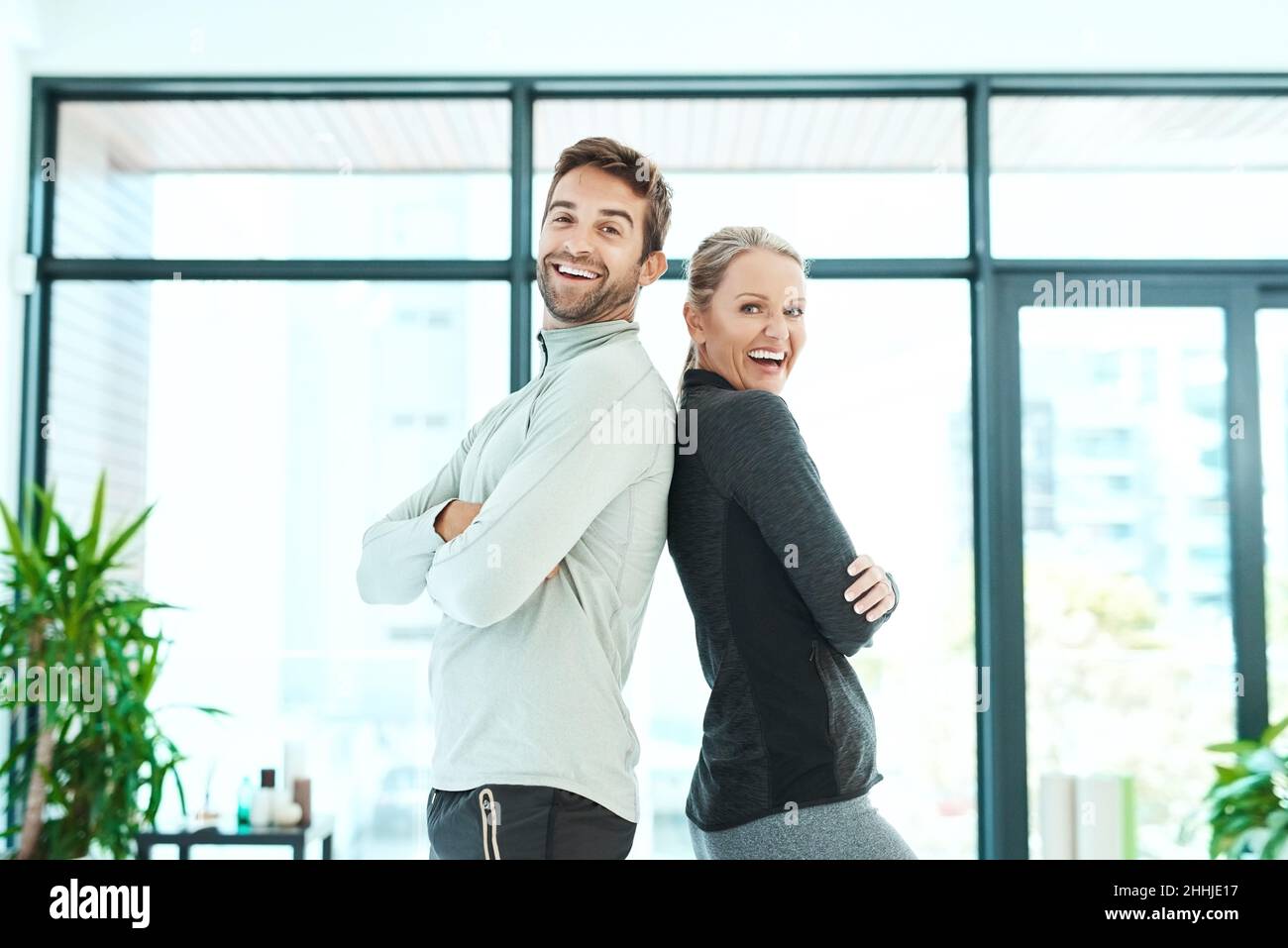 We work together. Cropped shot of two people standing together in a ...