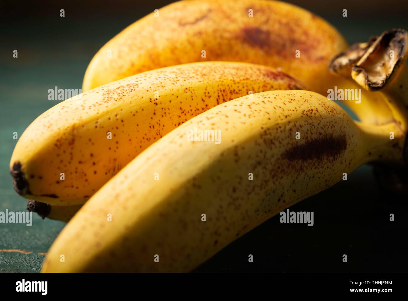 banana fruit on a wooden table Stock Photo - Alamy
