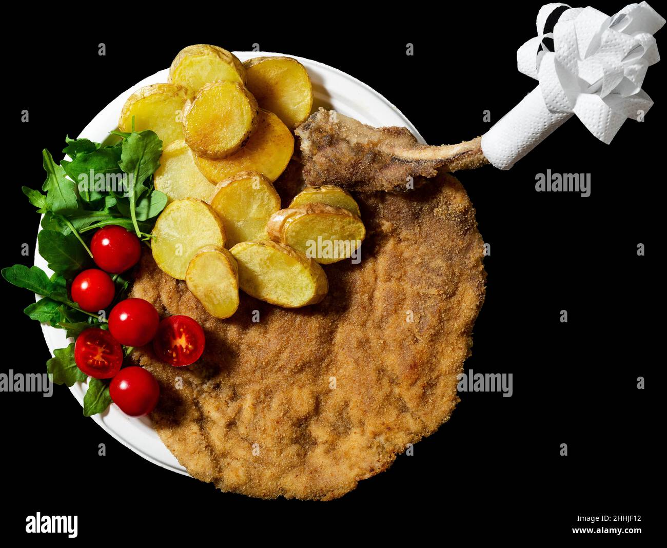 Milanese cutlet with roasted potatoes and salad Stock Photo - Alamy