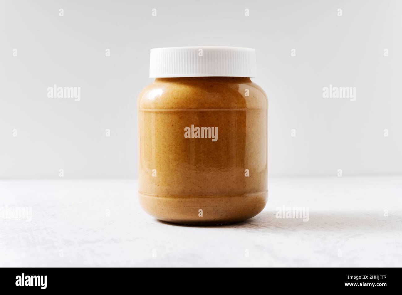 toasted tahini sesame sauce in jar on white table Stock Photo - Alamy