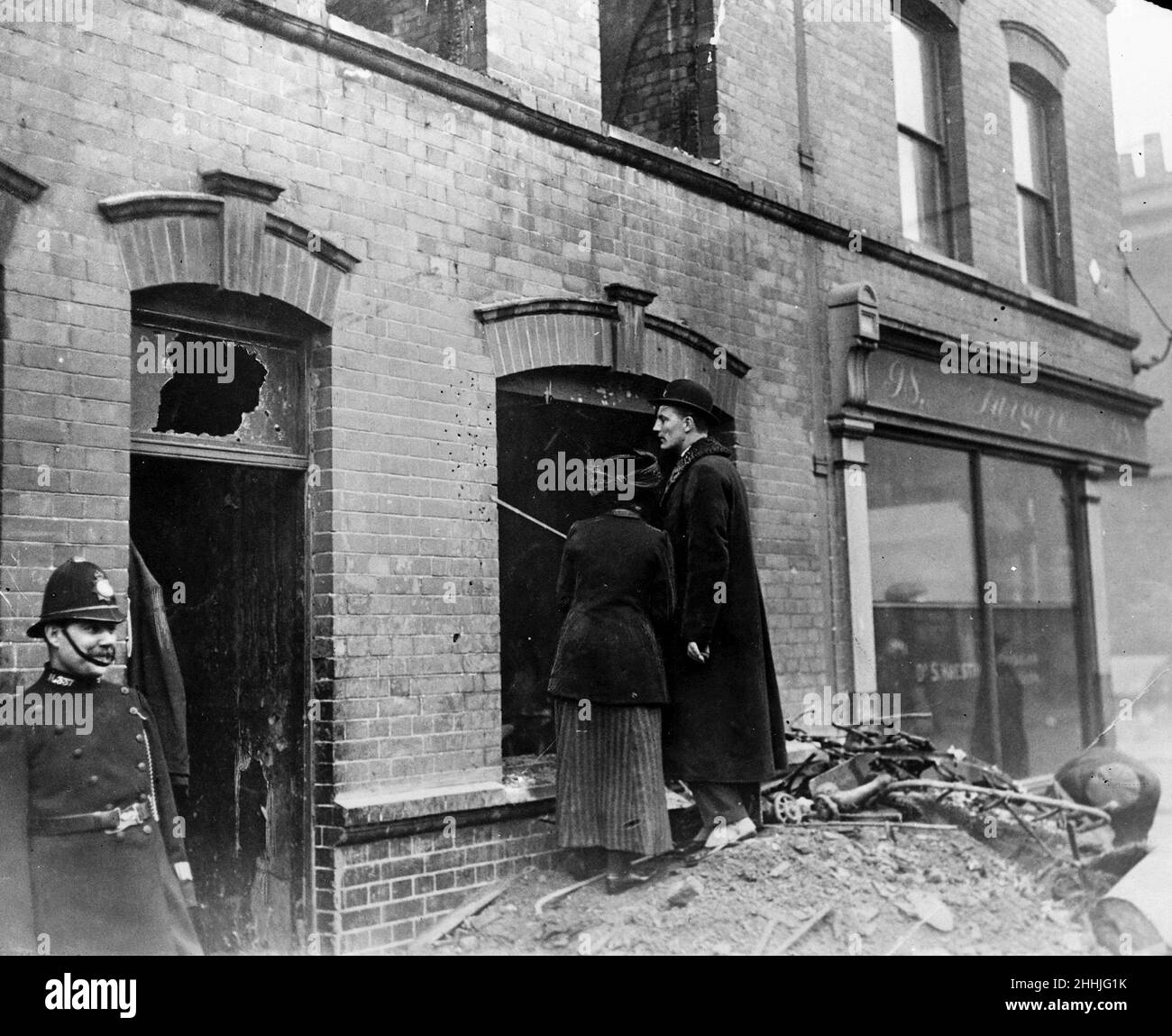 Sidney Street Siege, January 1911People looking at the bullett marks on ...