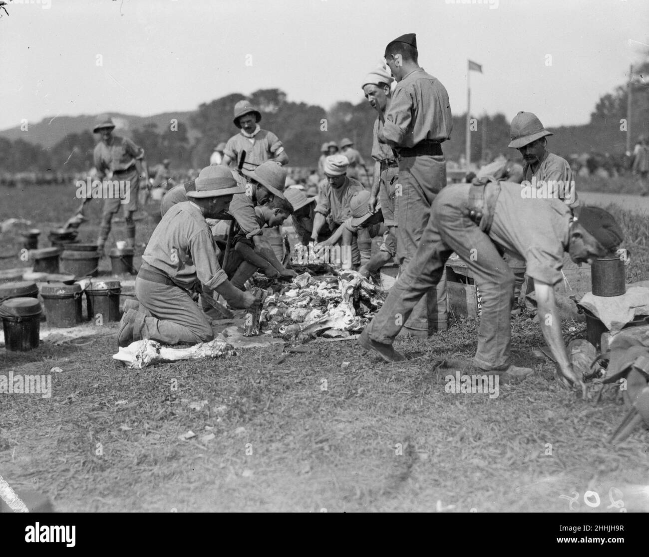 Members of the 1st Manchester Regiment seen here in their field kitchen ...