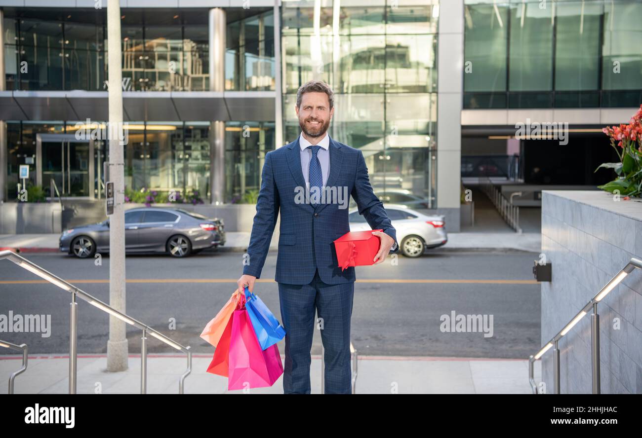 present for womens day. successful ceo holding gift packs Stock Photo ...