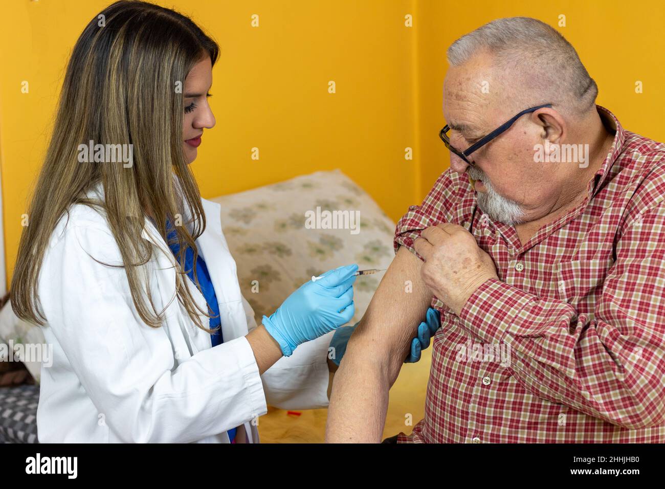 Immunizing homebound patients with covid-19 vaccine. Young doctor ...