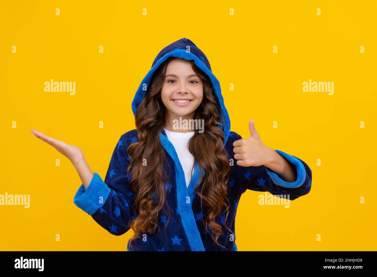 Presenting product. Happy girl give thumb showing open hand. Approval ...
