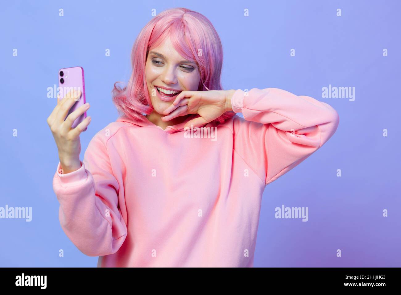 young woman use smartphone smile technology isolated background Stock ...