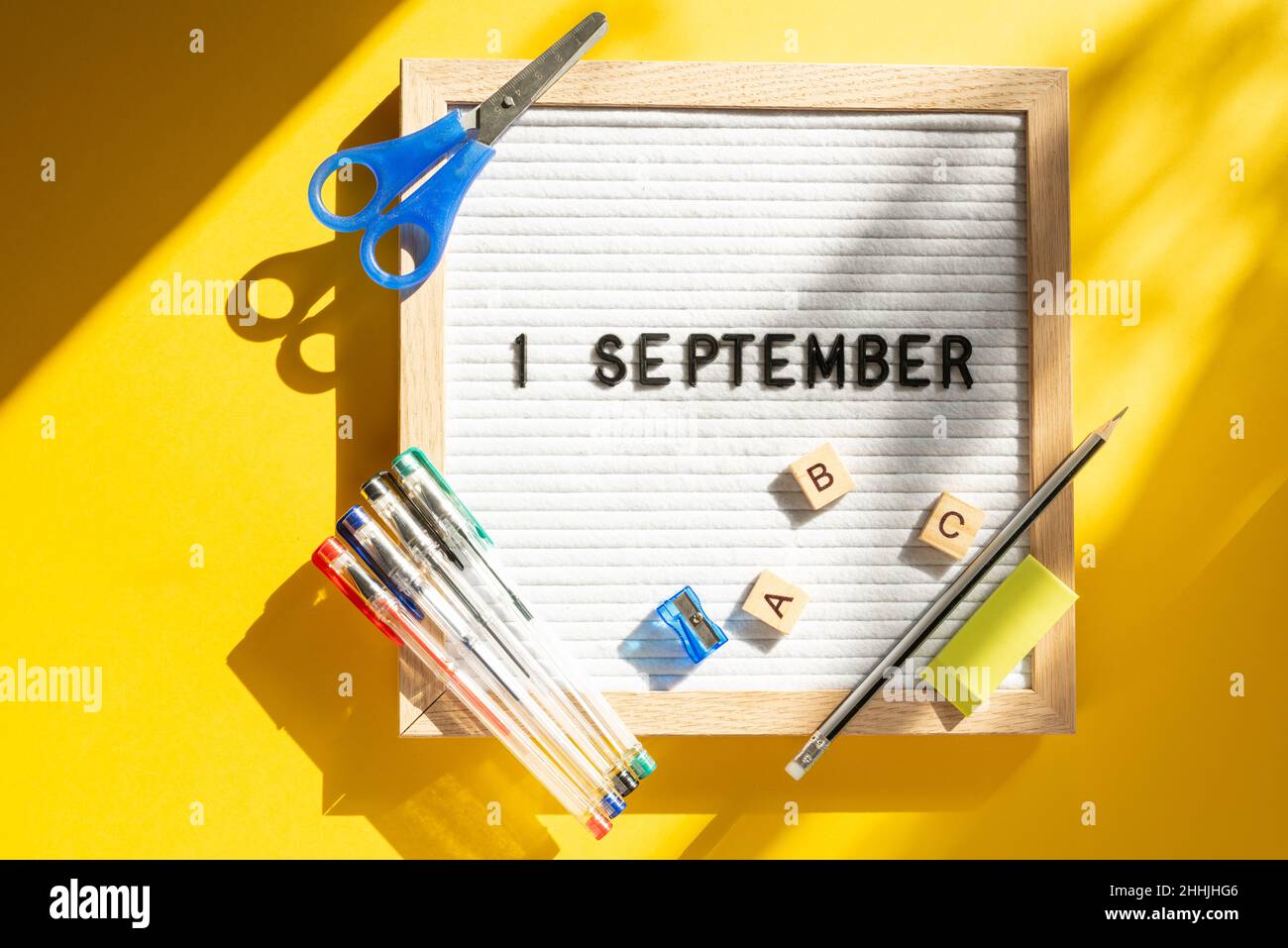 1 september letter board with school supplies as pens, scissors, ABC ...