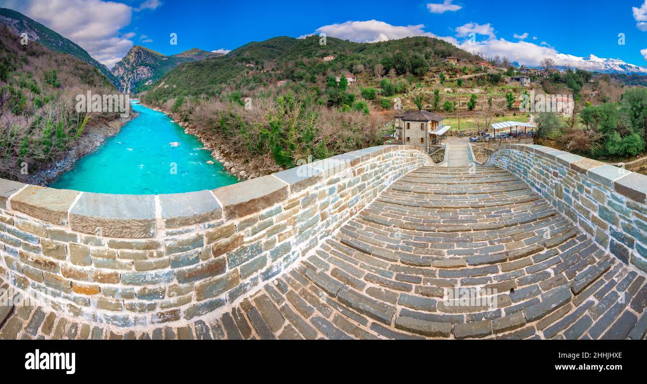 The great arched stone bridge of Plaka on Arachthos river, Tzoumerka ...