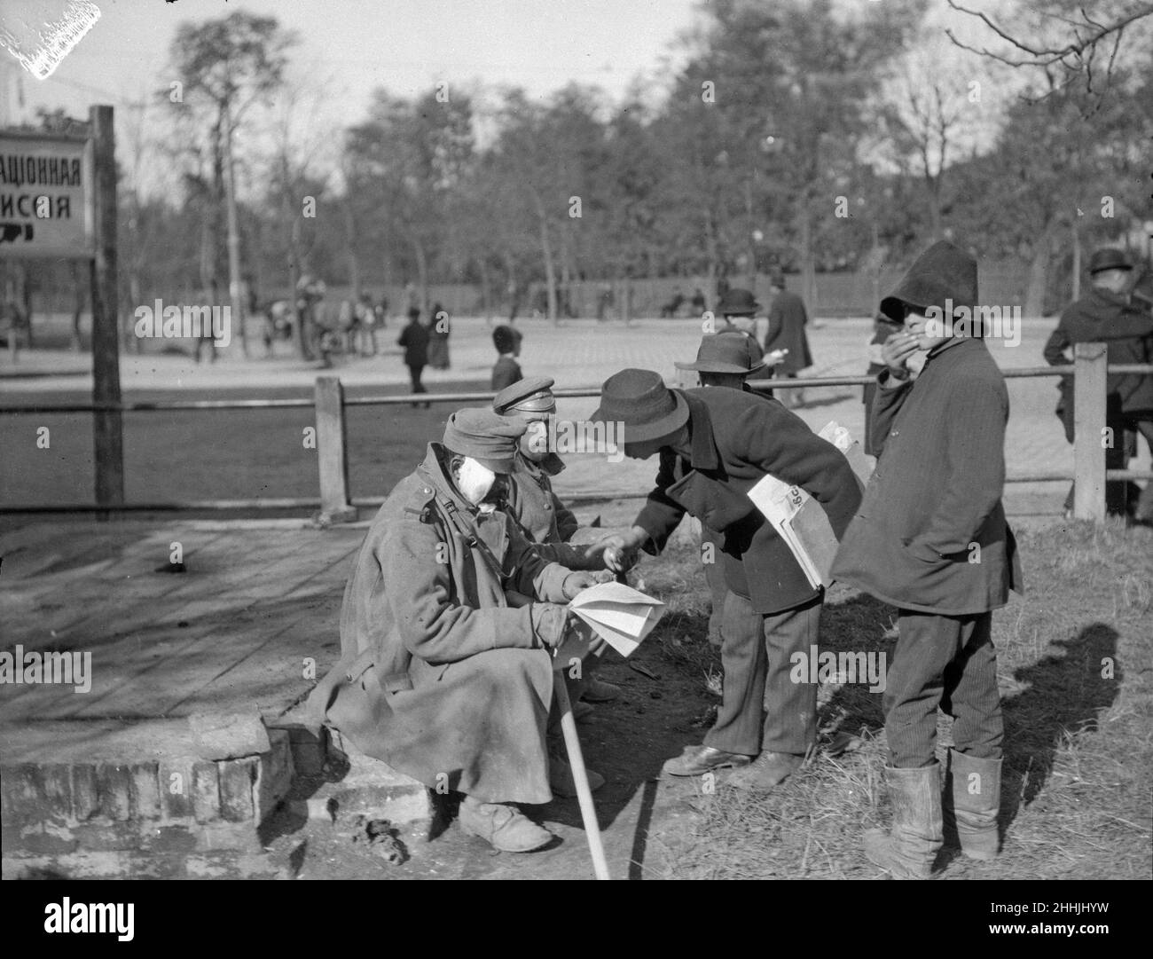 A wounded Russian and Austrian soldiers sitting side by side at Lemberg ...