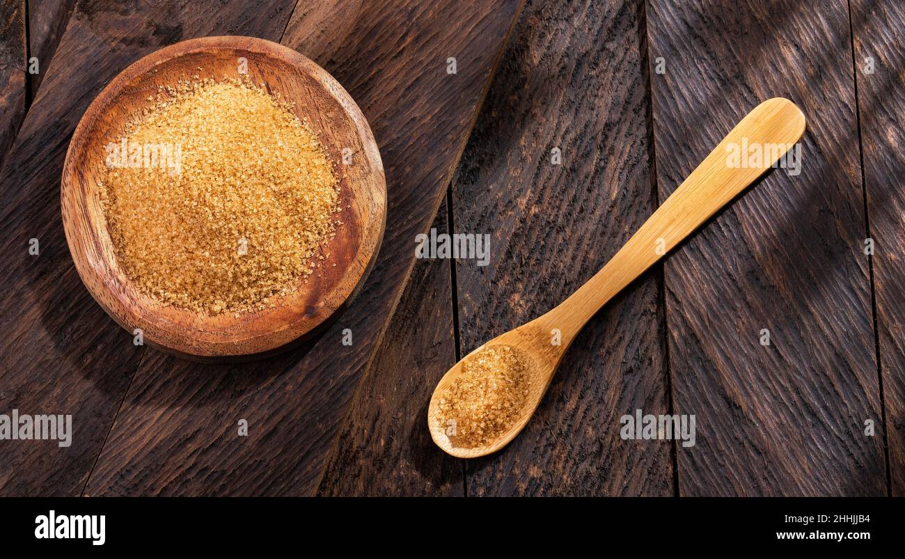 Organic brown sugar in the wooden bowl - Saccharum officinarum Stock ...