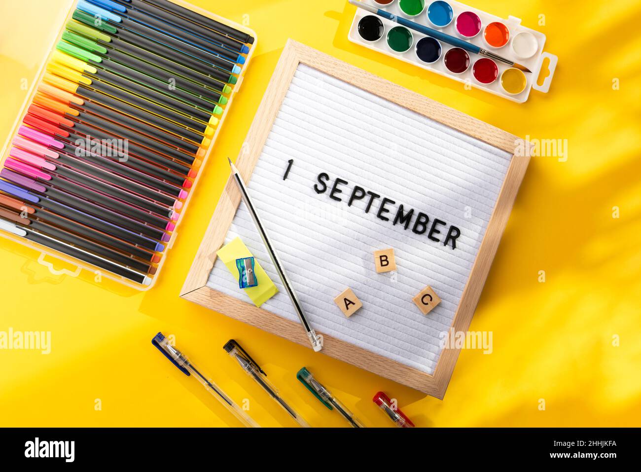 1 september letter board with school supplies as pens, scissors, ABC ...