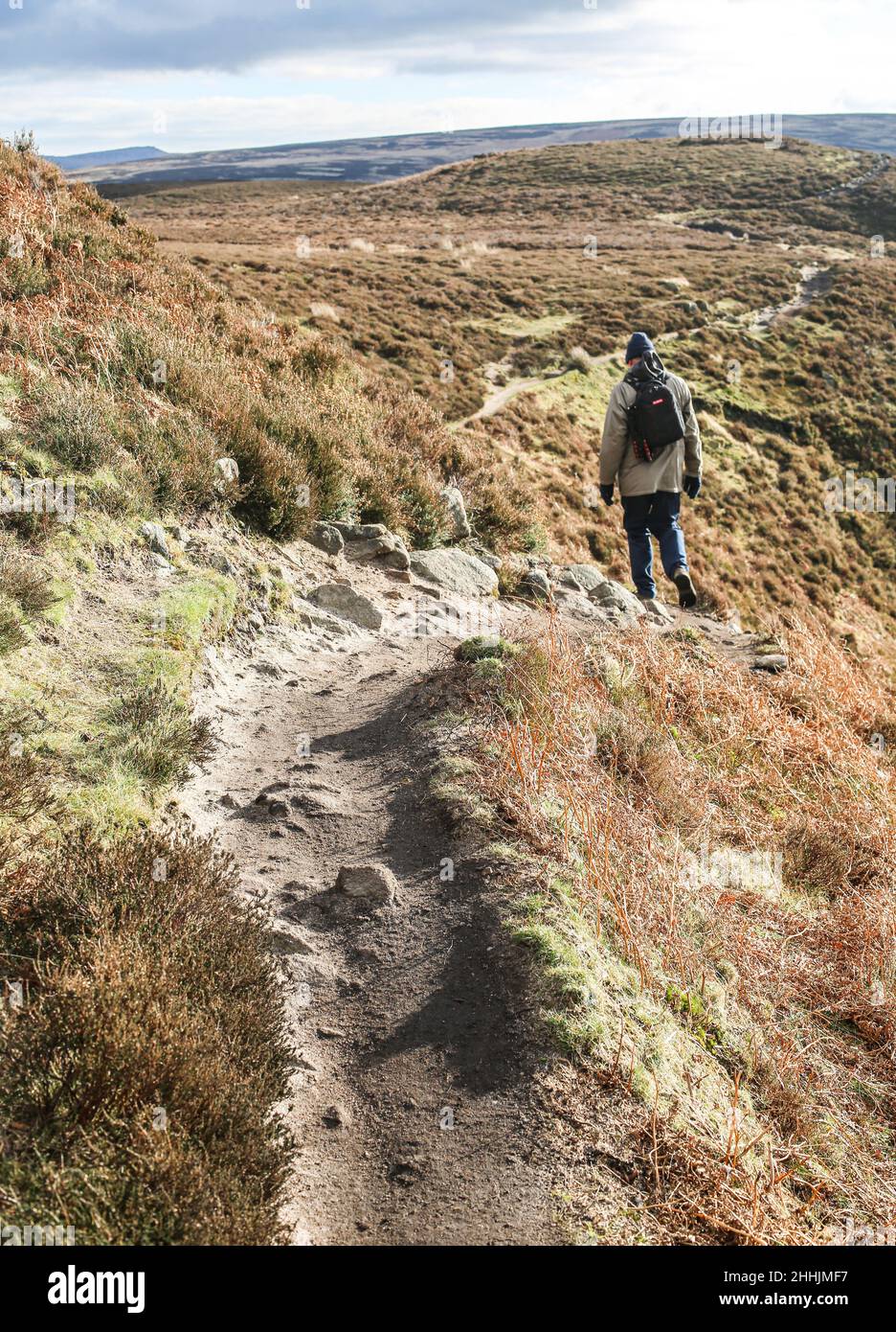 A person walking on the Derwent Edge path, Peak District UK Stock Photo ...