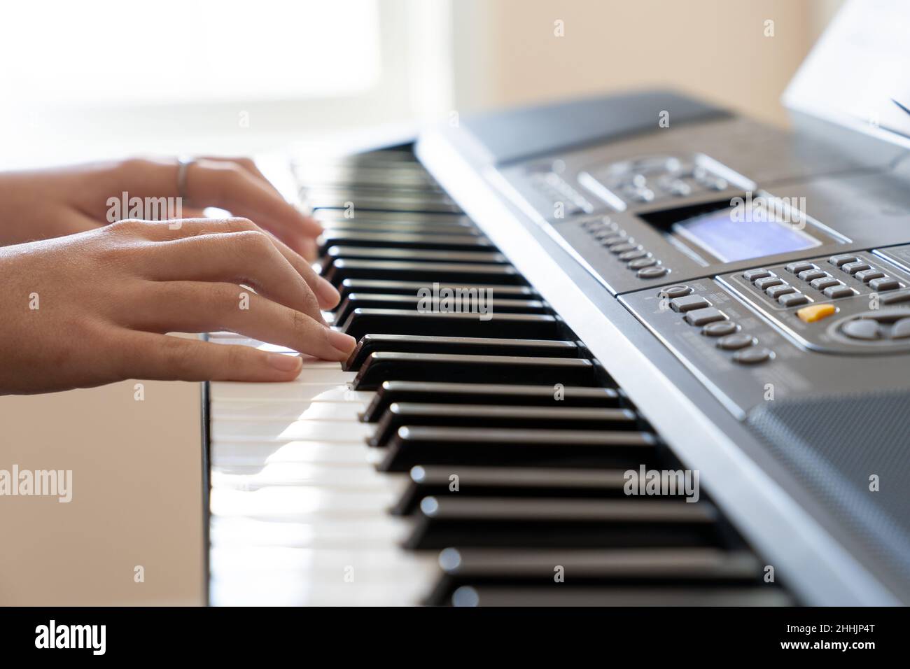 Hands of musician playing keyboard Stock Photo - Alamy