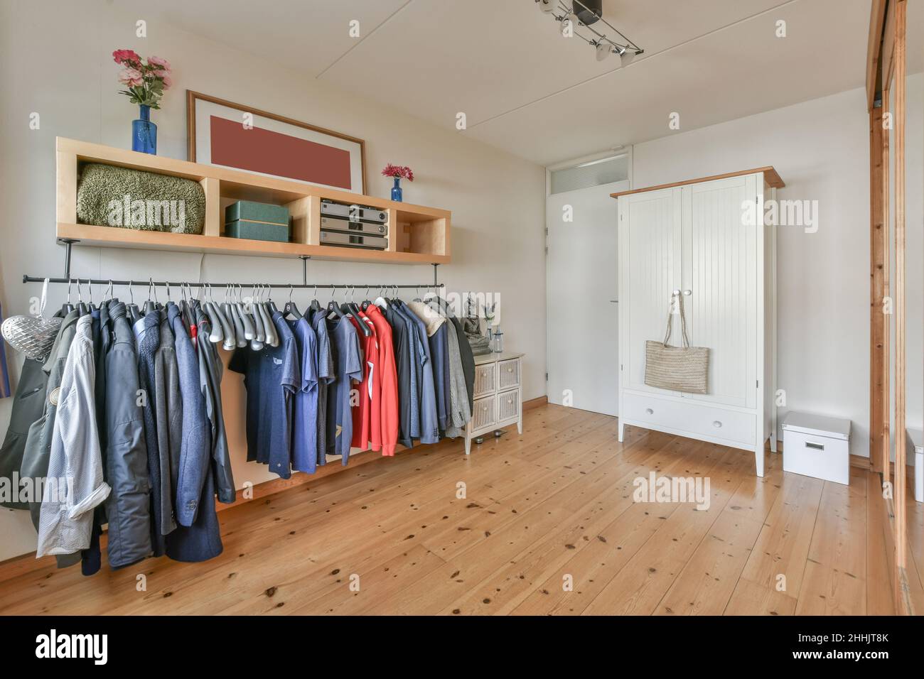 Garment bag in closet hi-res stock photography and images - Alamy