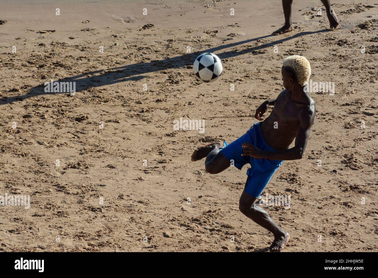 Young people playing sand football on the beach of Ondina in the ...