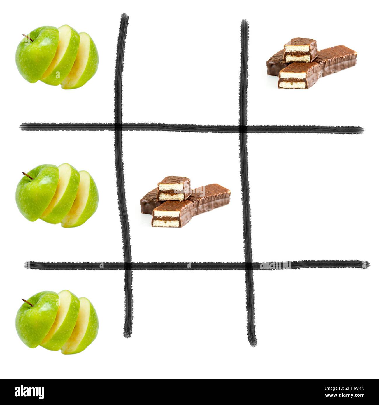 Tic tac toe with food, green apples and chocolate bars Stock Photo - Alamy