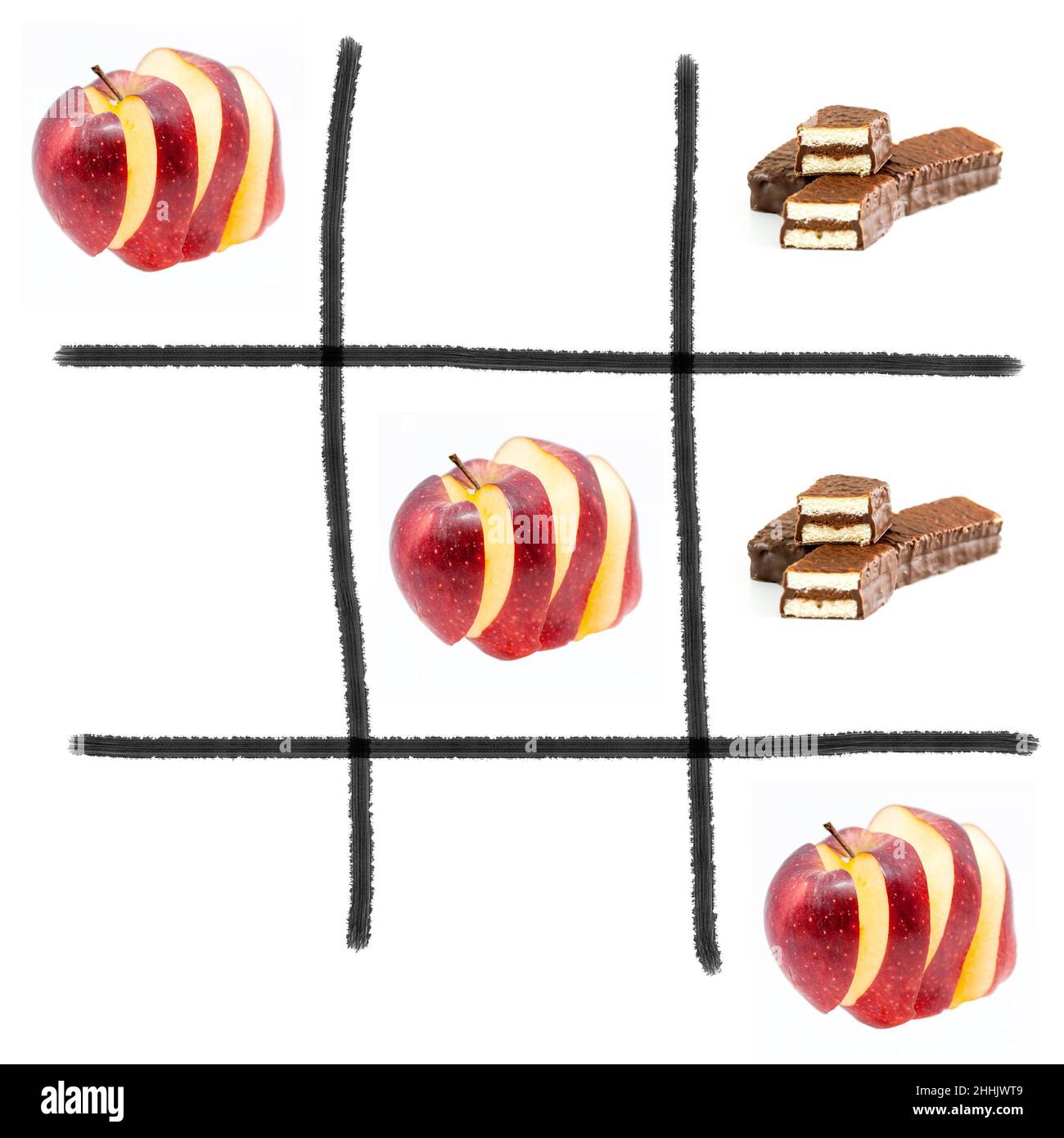 Tic tac toe with food, red apples and chocolate bars Stock Photo - Alamy