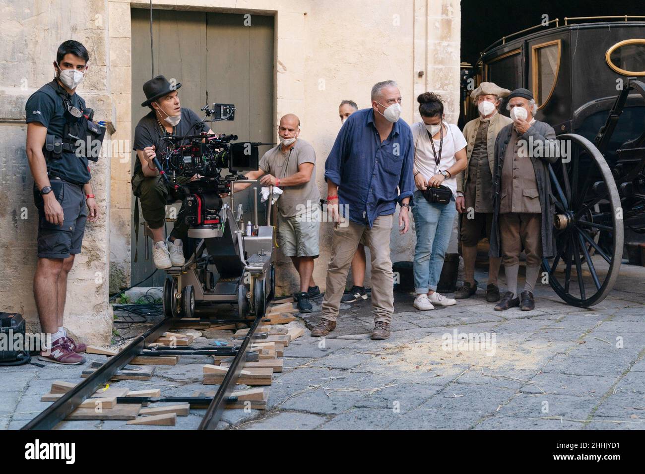 CYRANO, director Joe Wright (left, hat), cinematographer Seamus McGarvey (blue shirt), on set ...