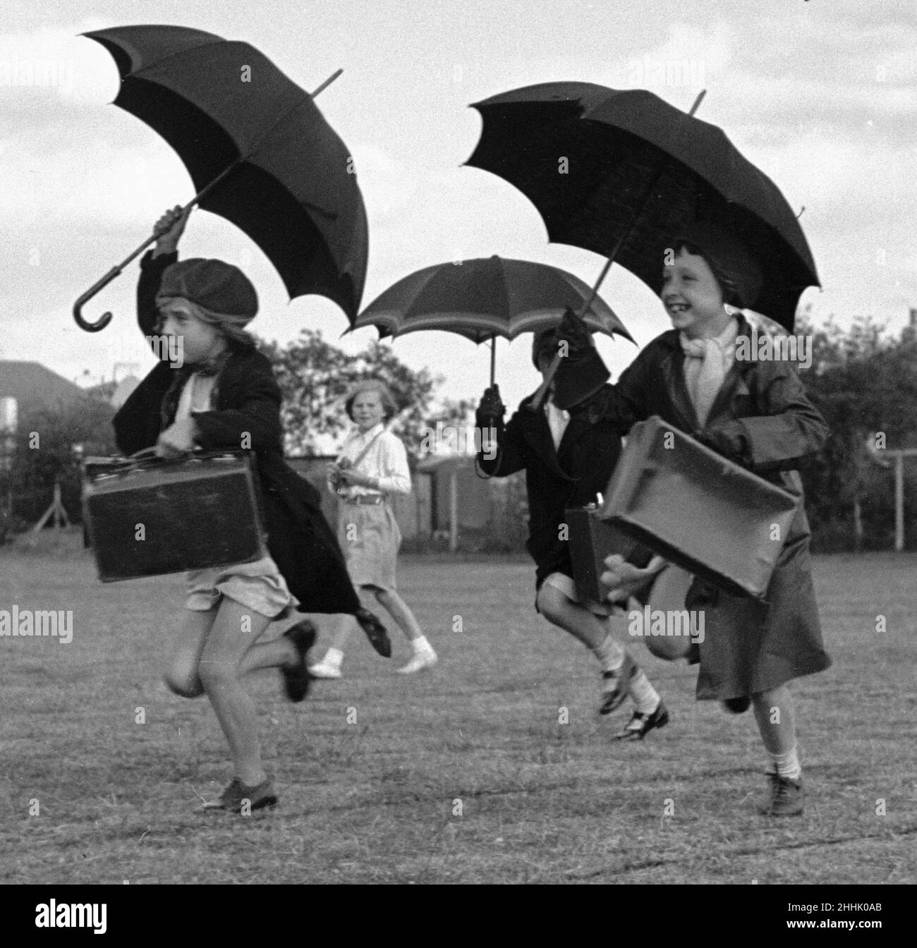 The umbrella race during a schools sports day in Kingston Upon Thames ...
