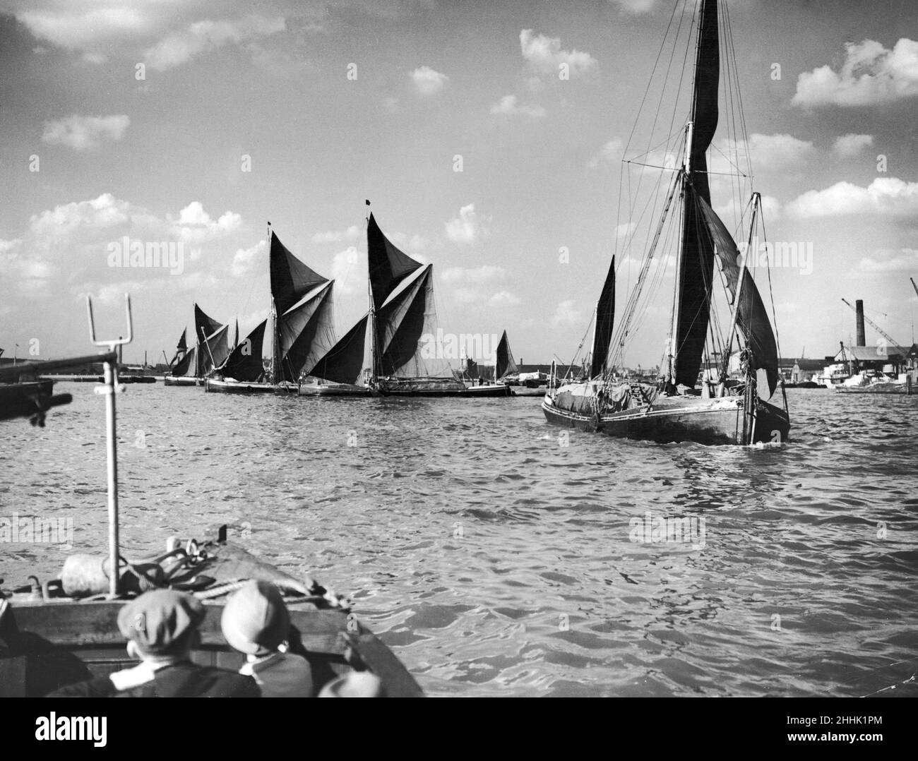 A busy scene on the River Thames where an unusual number of barges ...