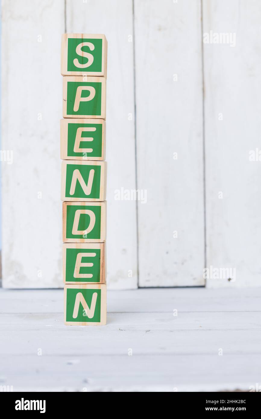 wooden cube, with with word spenden, on white background Stock Photo ...