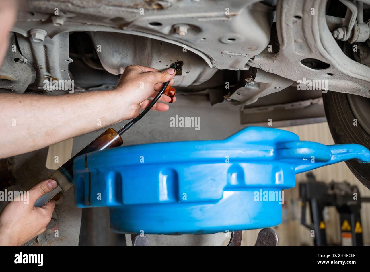 Change of old oil in a car engine Stock Photo - Alamy