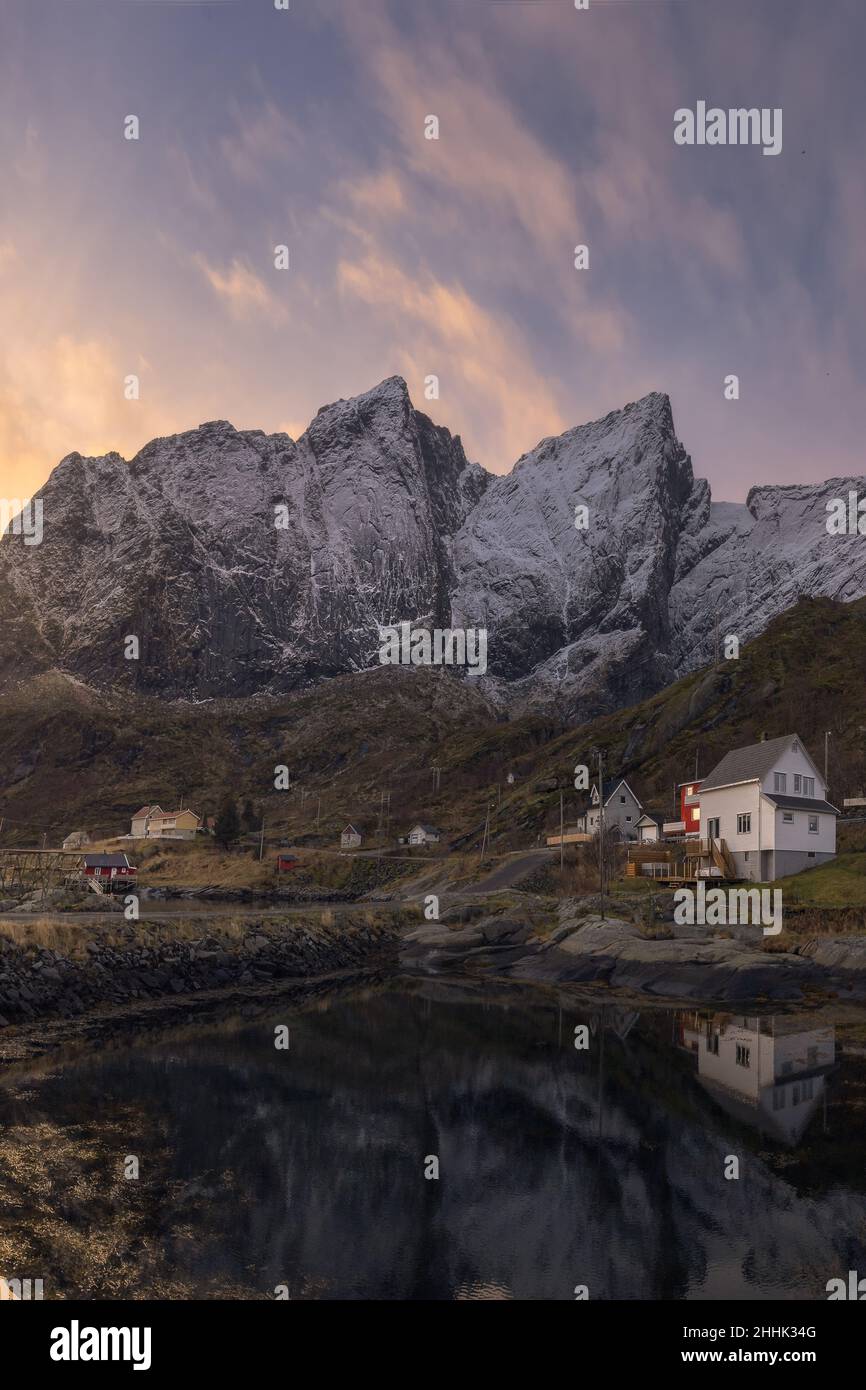 Breathtaking view of Reine village with red and white houses located on ...