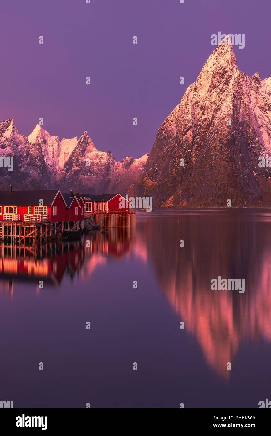 Breathtaking view of Reine village with red and white houses located on ...