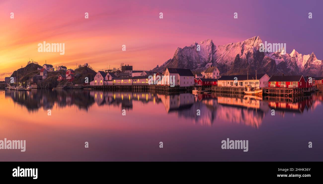 Breathtaking view of Reine village with red and white houses located on ...
