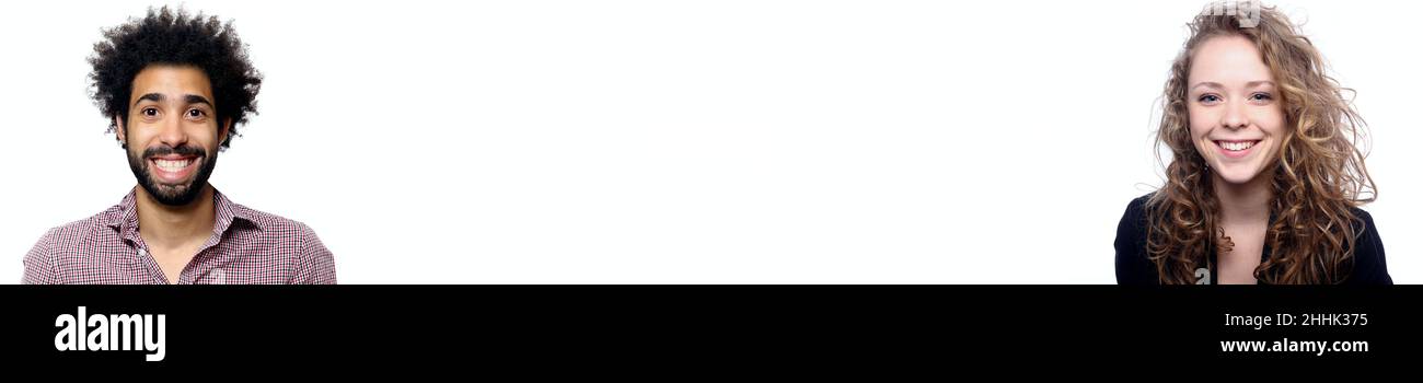 Two people in front of a white background with a white space in between ...