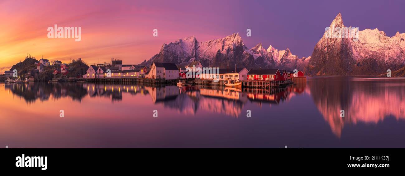 Breathtaking view of Reine village with red and white houses located on ...