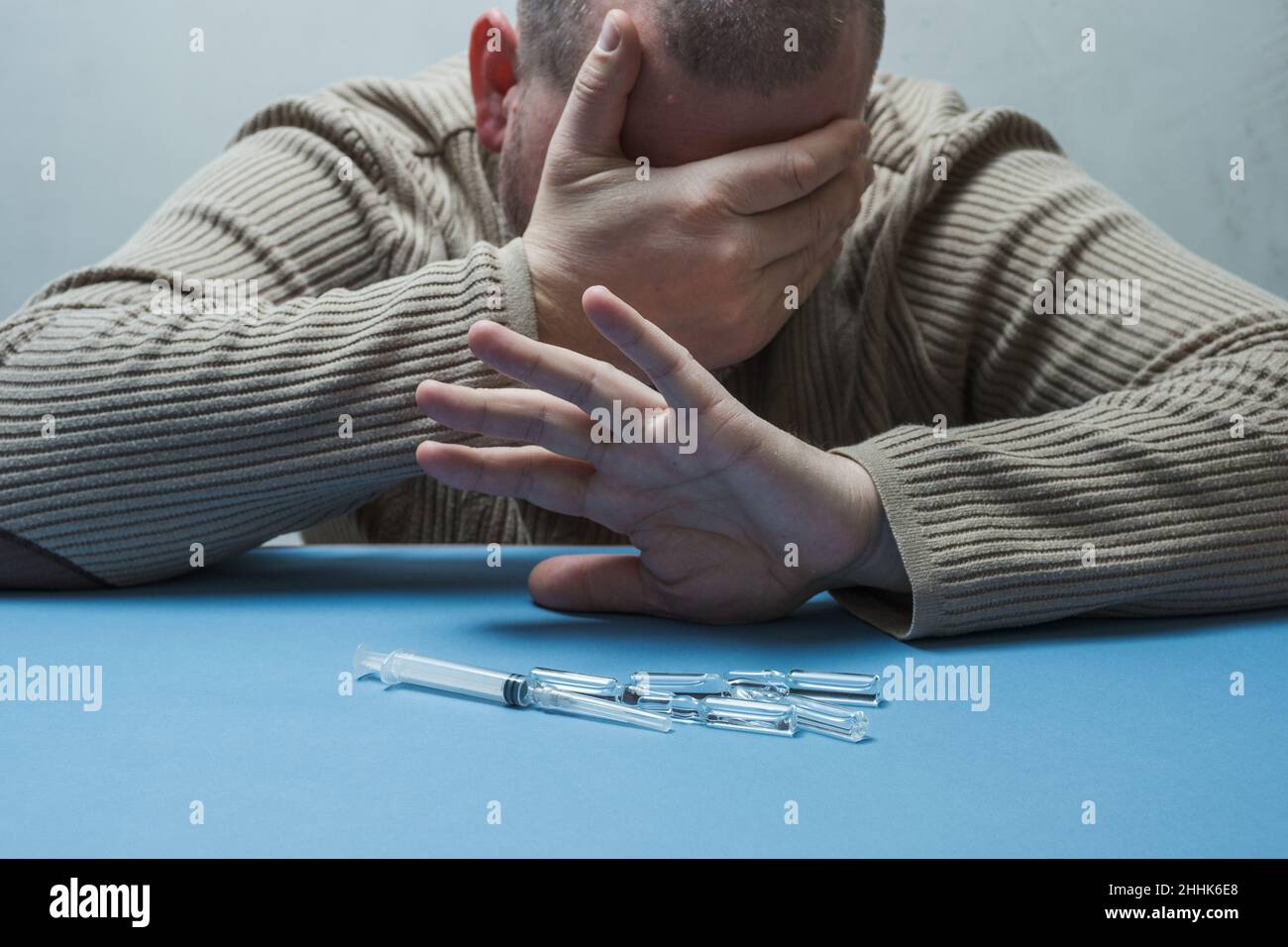 The man refuses medical preparations with a gesture Stock Photo - Alamy