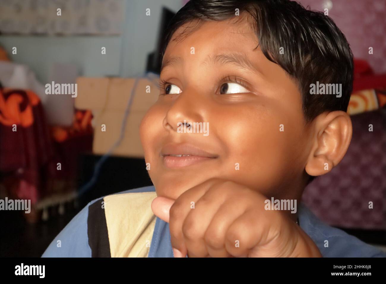 Expression of thoughtfulness by the kid Stock Photo - Alamy