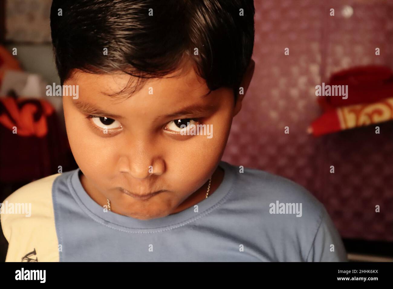 Expression of angry face by the kid Stock Photo - Alamy